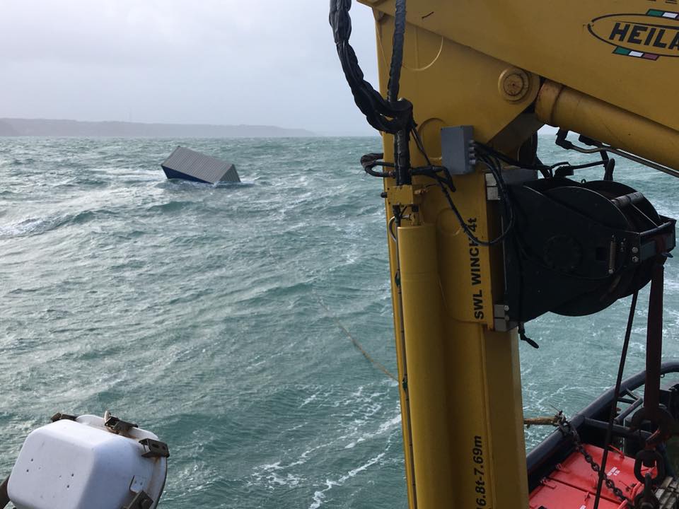 Wild weather in pictures: drifting sea container recovered off coast of ...
